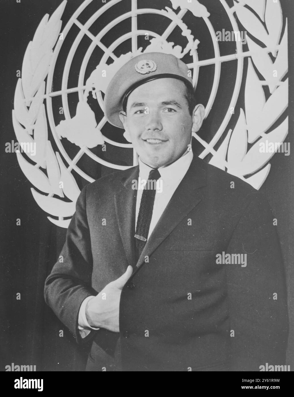 WEARING A UNITED NATIONS CAP BOXER INGEMAR JOHANSSON STANDS BENEATH THE ...