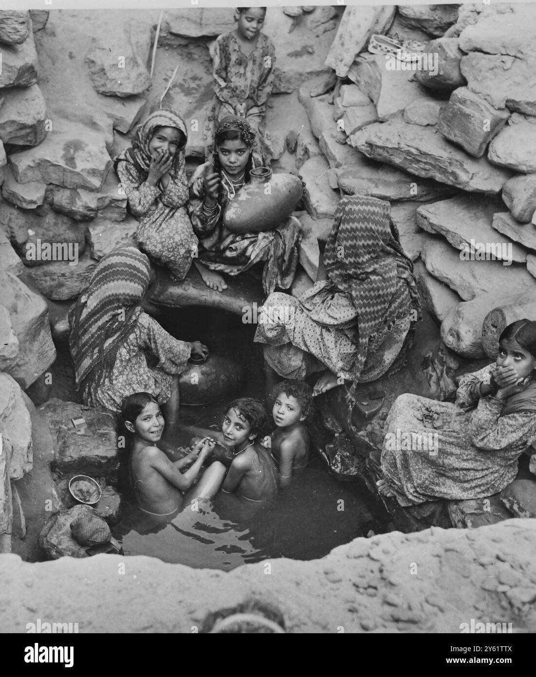 CHILDREN ARE BATHING IN AN ANCIENT ROMAN WELL IN THE DAKHLA OASIS 12 ...