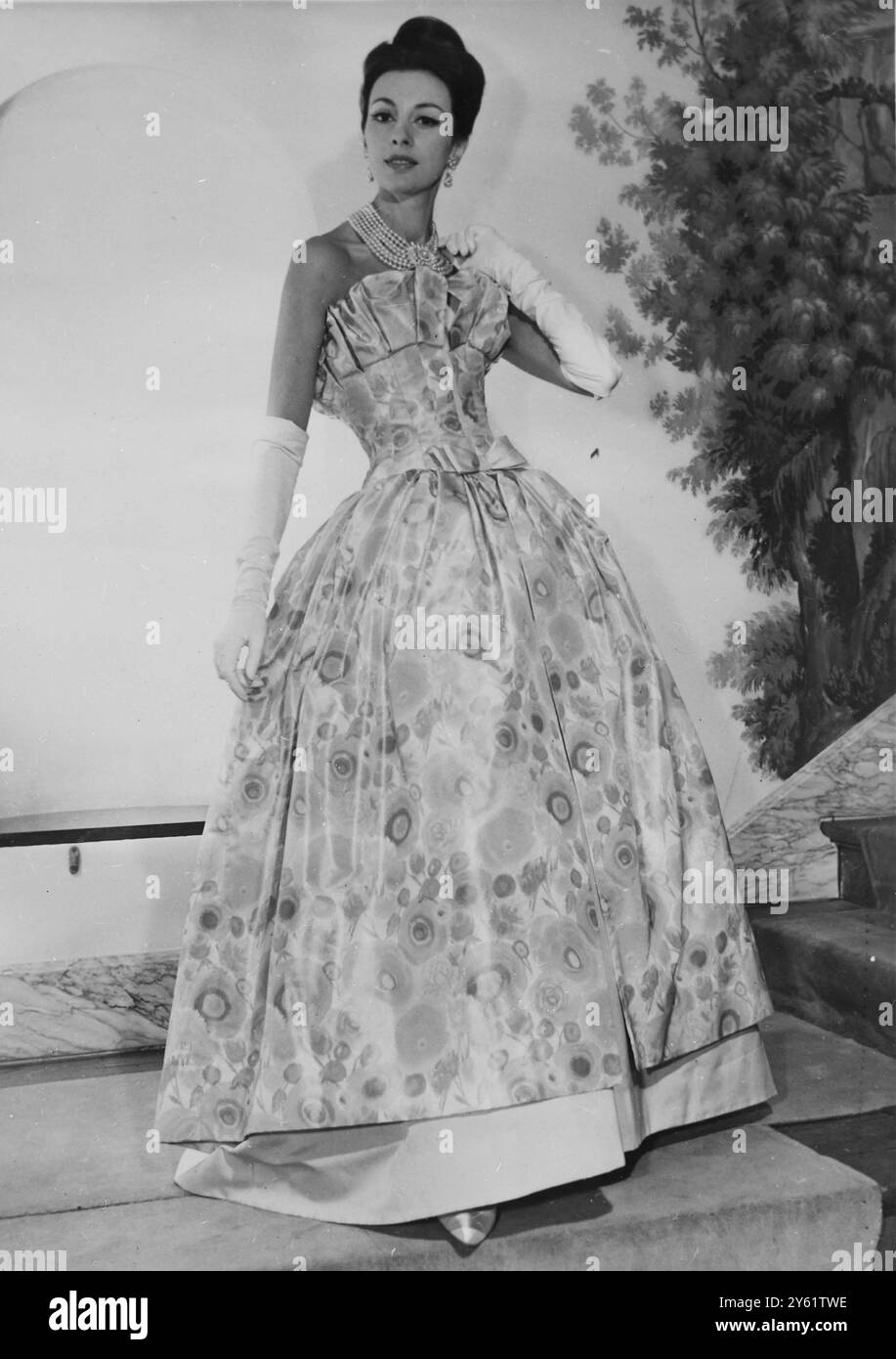 A MODEL WEARING A PIERRE BALMAIN FASHION CREATION A FORMAL EVENING GOWN ...