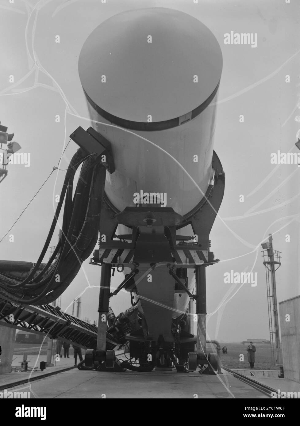 THE THOR BALLISTIC MISSILE TIS LAUNCHED INTO THE FIRING POSITION AT THE ...