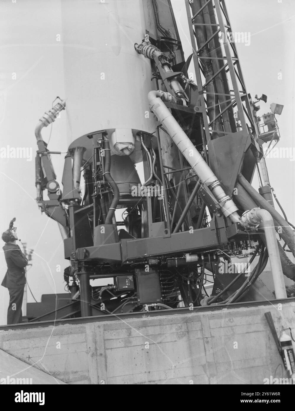 MASTER NAVIGATOR LACHLAN BROWN CHECKS THE MISSILE CLAMPING EQUIPMENT ...