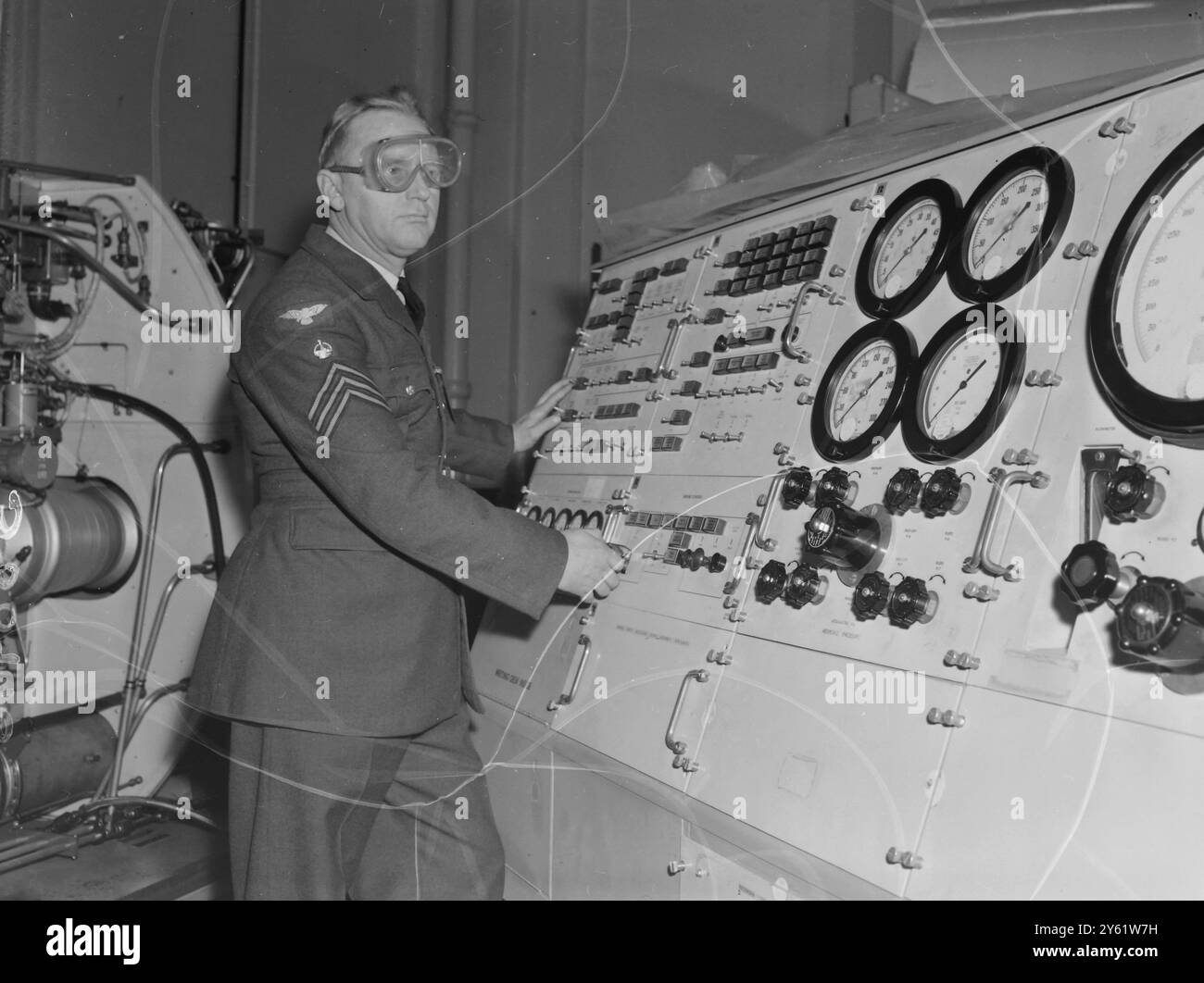 AT THE CONTROL PANEL IS ROCKET ENGINE CHECKER CHIEF TECHNICIAN JOHN G ...