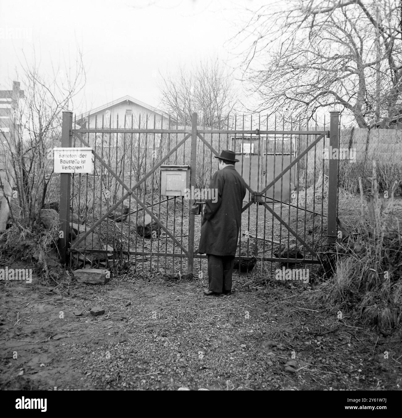 UPI REPORTER BOB MUSEL AT THE GATEWAY TO THE SMALL GREEN HUT IN THE ...