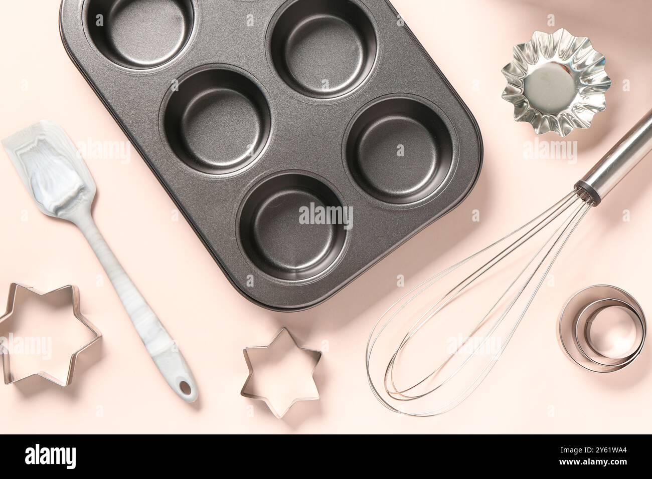 Baking form and utensils on beige background Stock Photo - Alamy