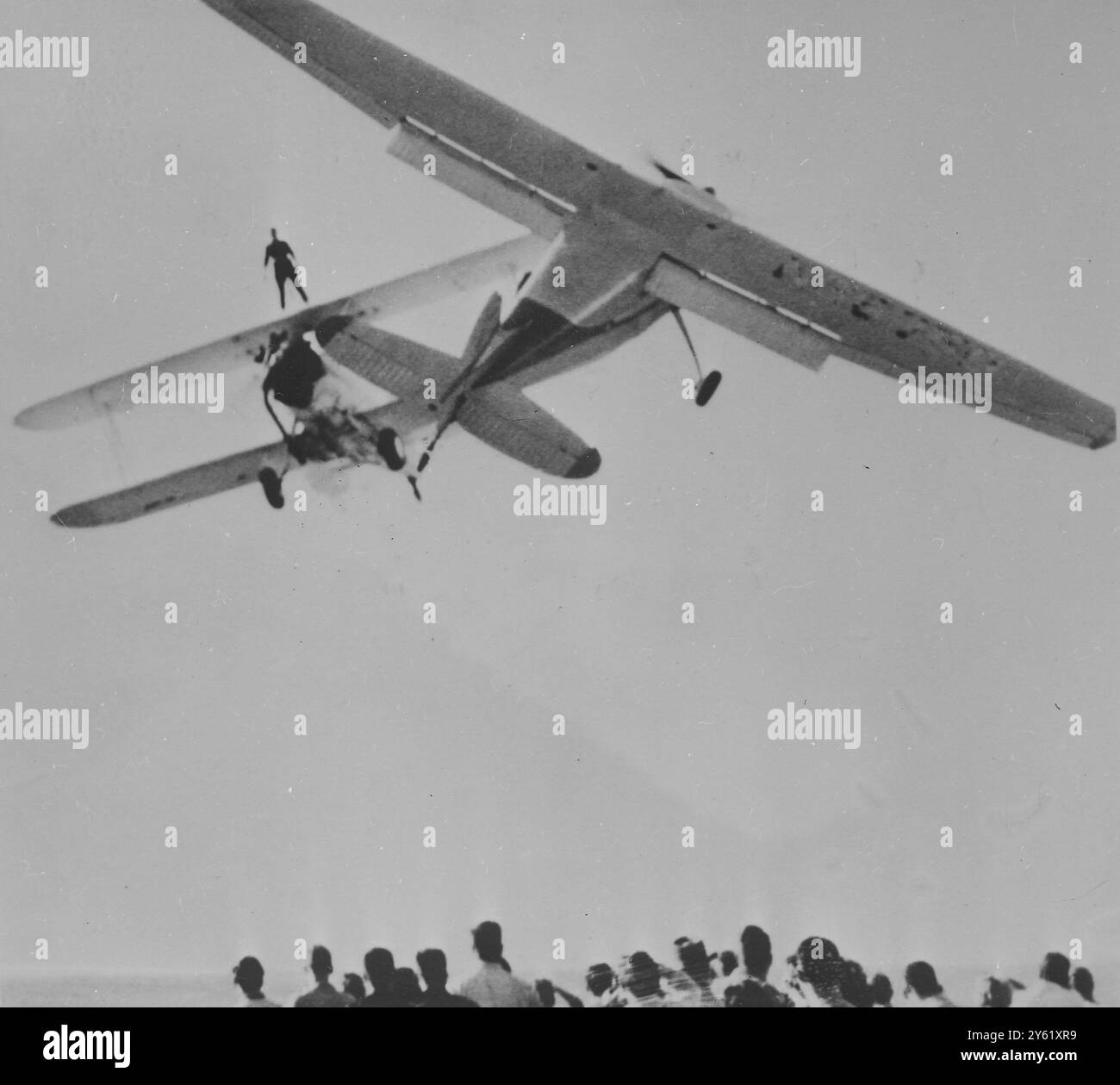 A DRAMATIC PICTURE AS A BIPLANE CARRYING A WING WALKER ( LEFT ...