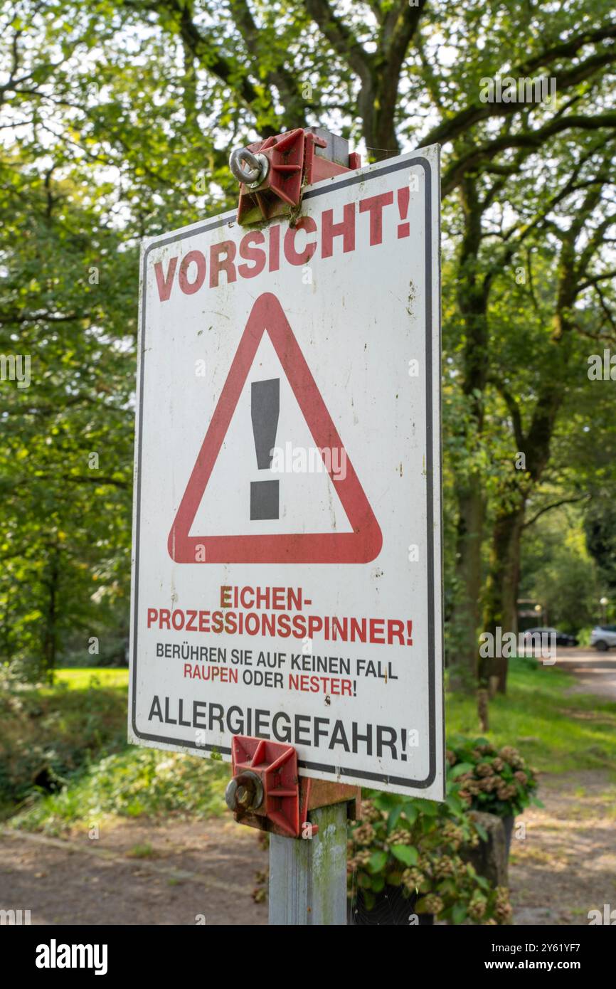 Warning of the oak processionary moth, in a public park, touching can ...