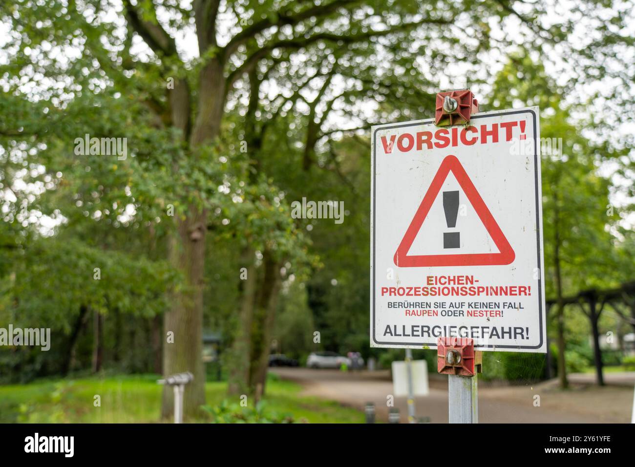 Warning of the oak processionary moth, in a public park, touching can ...