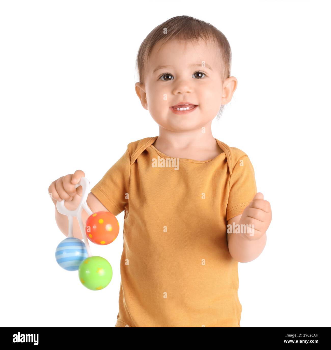 Cute baby with rattle on white background Stock Photo - Alamy