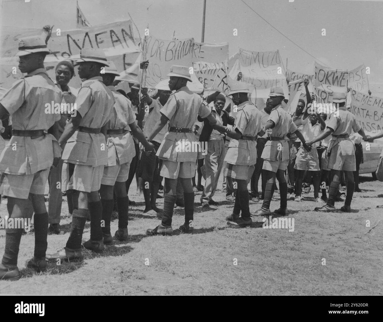 Police hold back demonstrators hi-res stock photography and images - Alamy