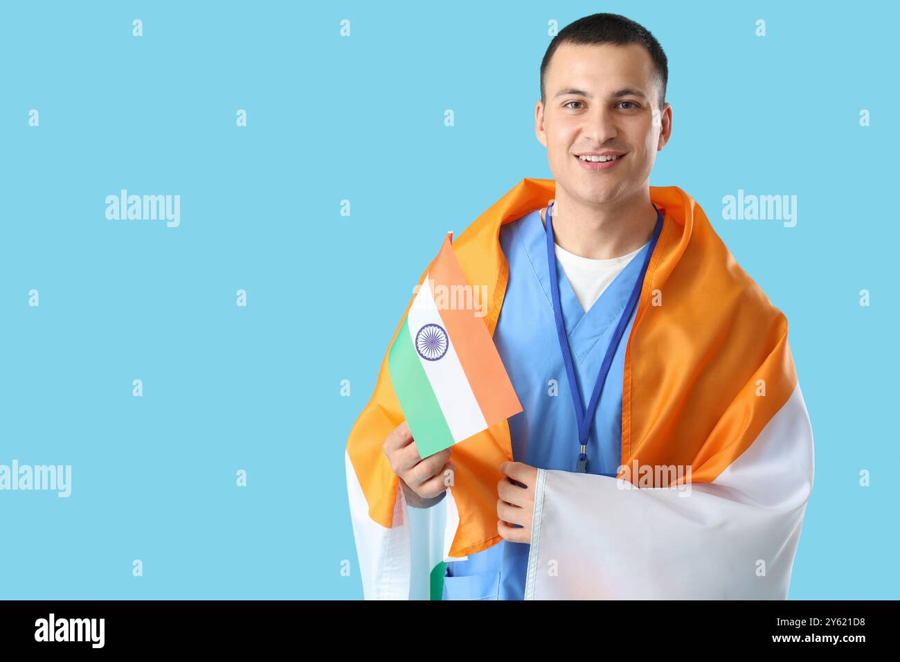 Male doctor with flags of India on blue background. National Doctor's ...
