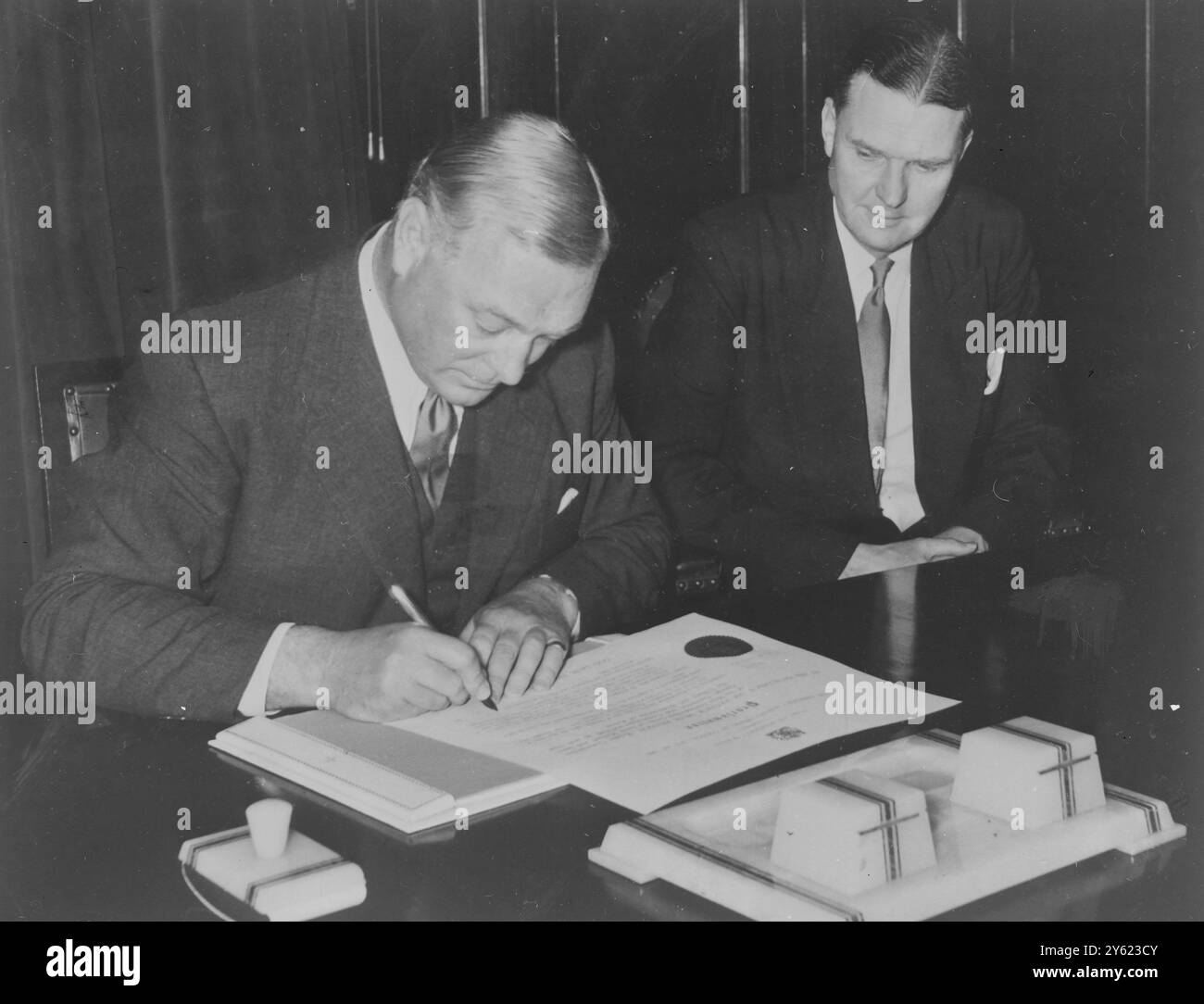 GOVERNOR OF KENYA SIR PATRICK RENISON SIGNING THE PROCLAMATION FORMALLY ...
