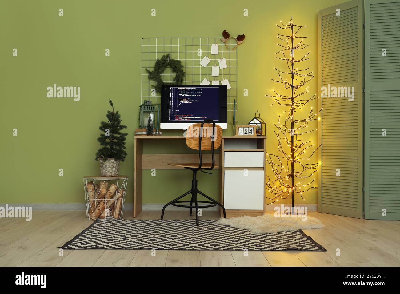 Interior of programmer's office with workplace, Christmas tree and ...