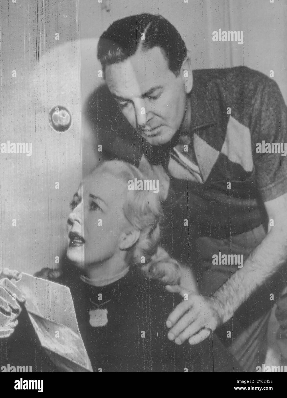 ACTOR JOHN SUTTON EXAMINES A BLACKMAIL LETTER RECEIVED BY HIS WIFE ...