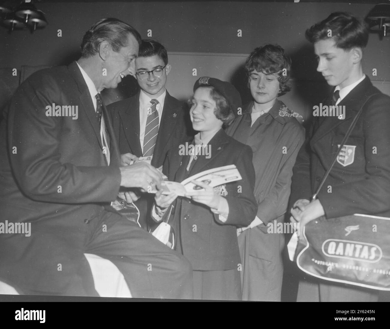 AUSTRALIAN ACTOR CHIPS RAFFERTY HANDS OUT AIRLINE TICKETS TO FOUR ...