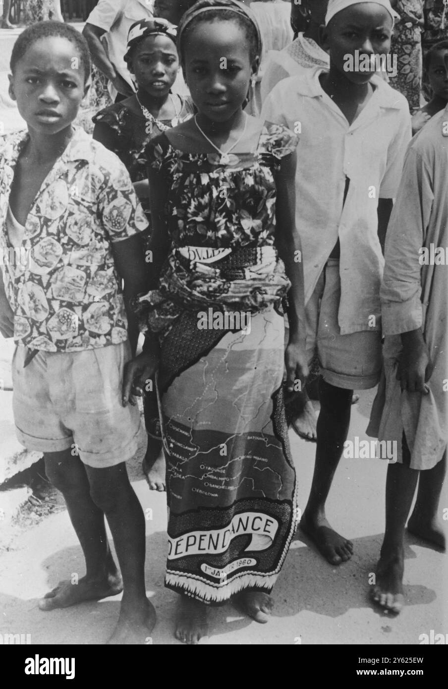 A LITTLE GIRL WEARING A DRESS BEARING A MAP OF KAMERUN DURING THE ...
