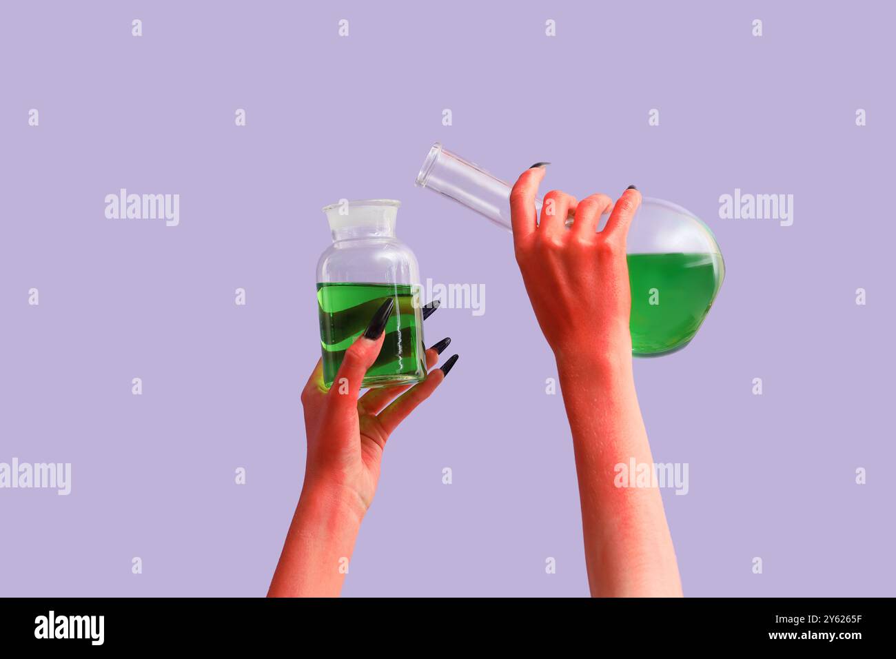 Devil hands holding flasks with poison on lilac background. Halloween ...