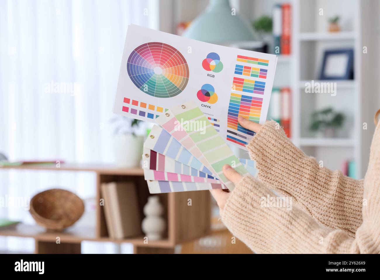 Female web designer with color palettes in office, closeup Stock Photo ...
