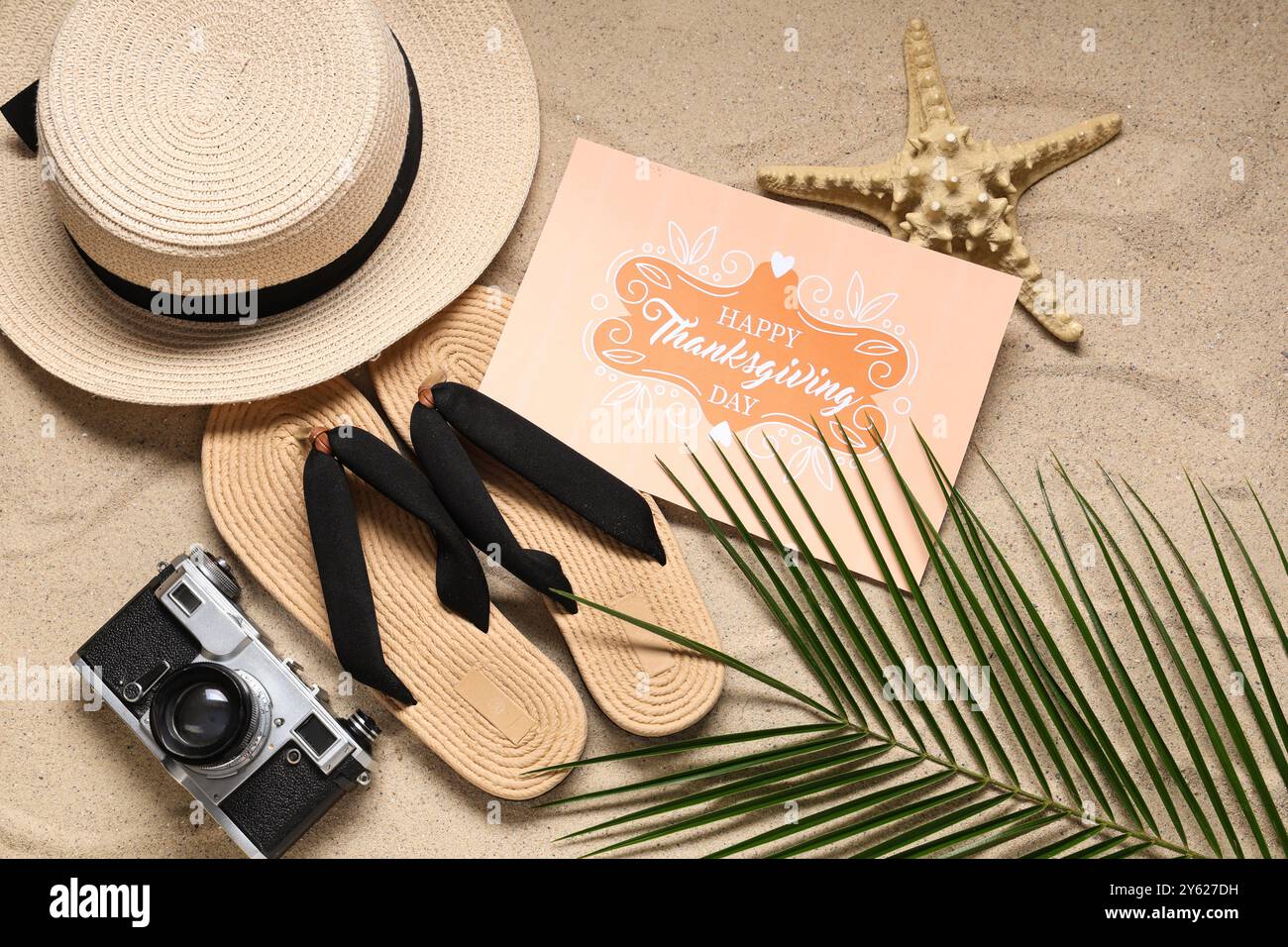 Card for Thanksgiving Day with beach accessories and palm leaf on sand ...