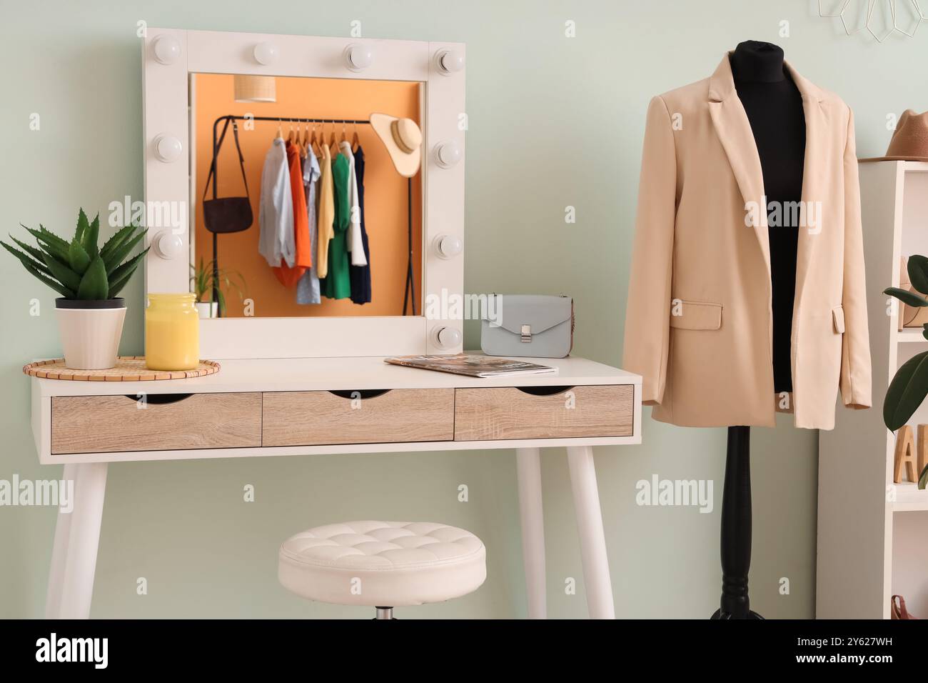 Interior of room with mannequin and dressing table Stock Photo - Alamy