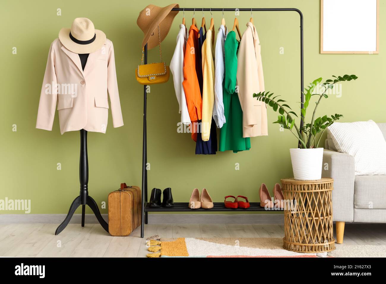 Interior of dressing room with mannequin and clothes rack Stock Photo ...