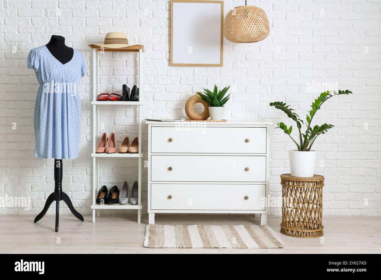 Interior of dressing room with mannequin, shelf unit and commode Stock ...