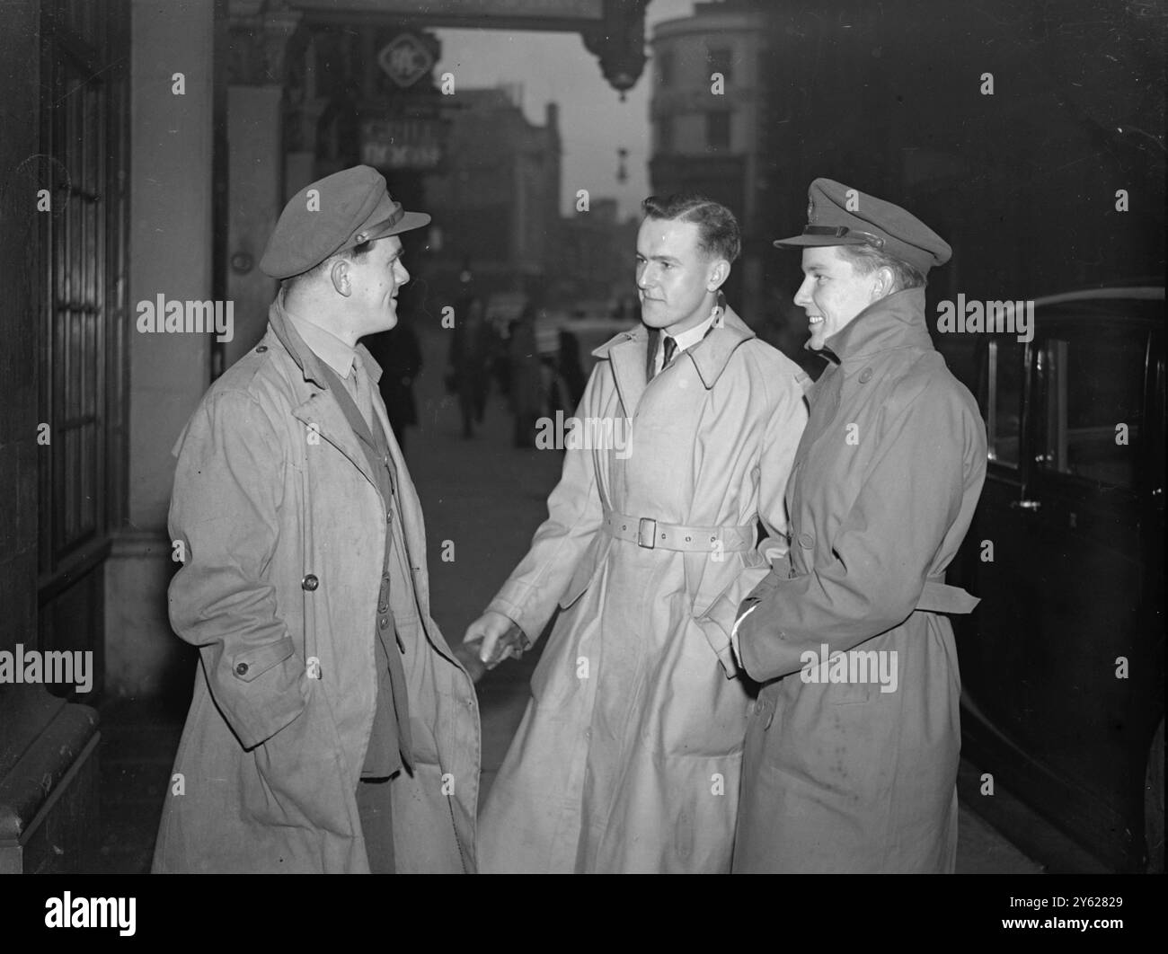 Three young army officers driving back to camp after celebrating at a ...