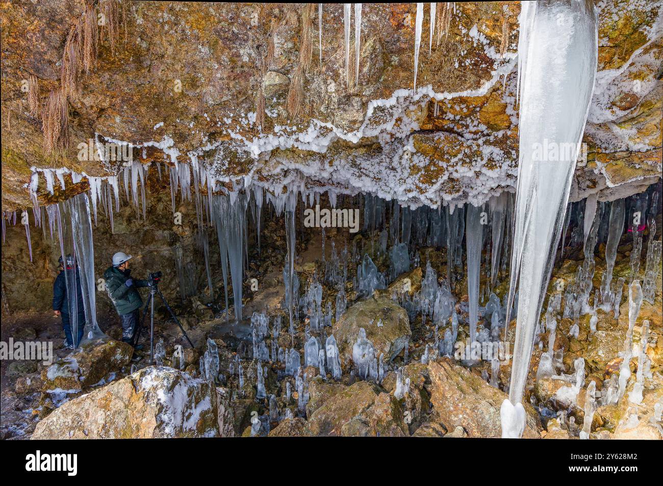 Hikers in the Otaki "frozen bamboo cave" in the forests of Hokkaido ...