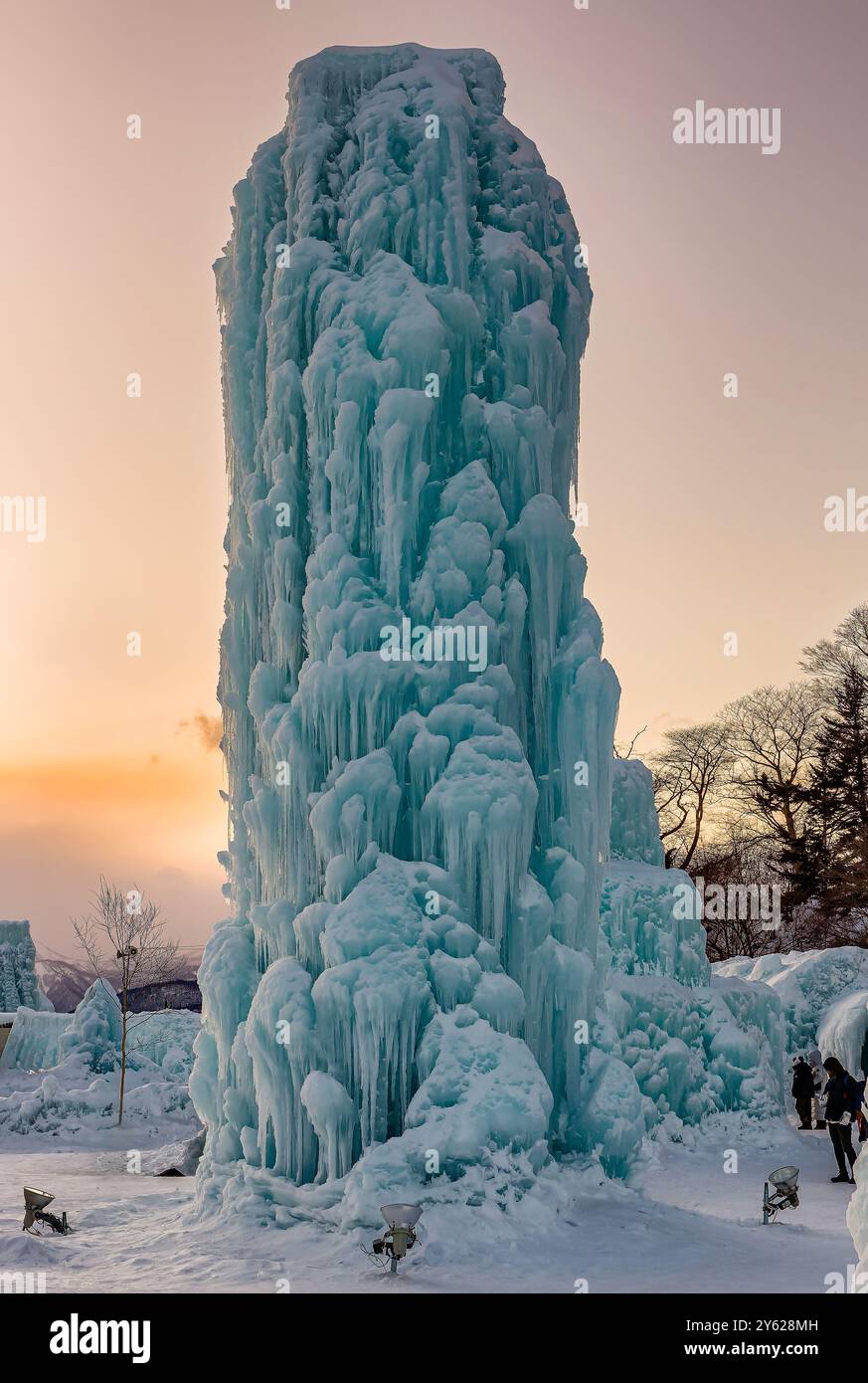 Visitors exploring huge frozen ice sculptures on the shore of Lake ...