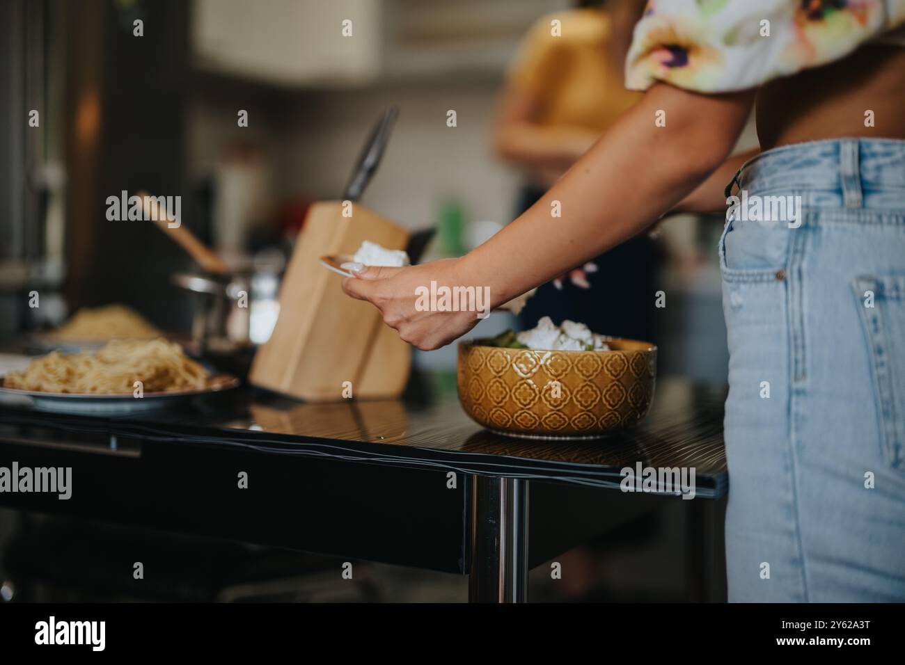 Woman plating up food hi-res stock photography and images - Alamy