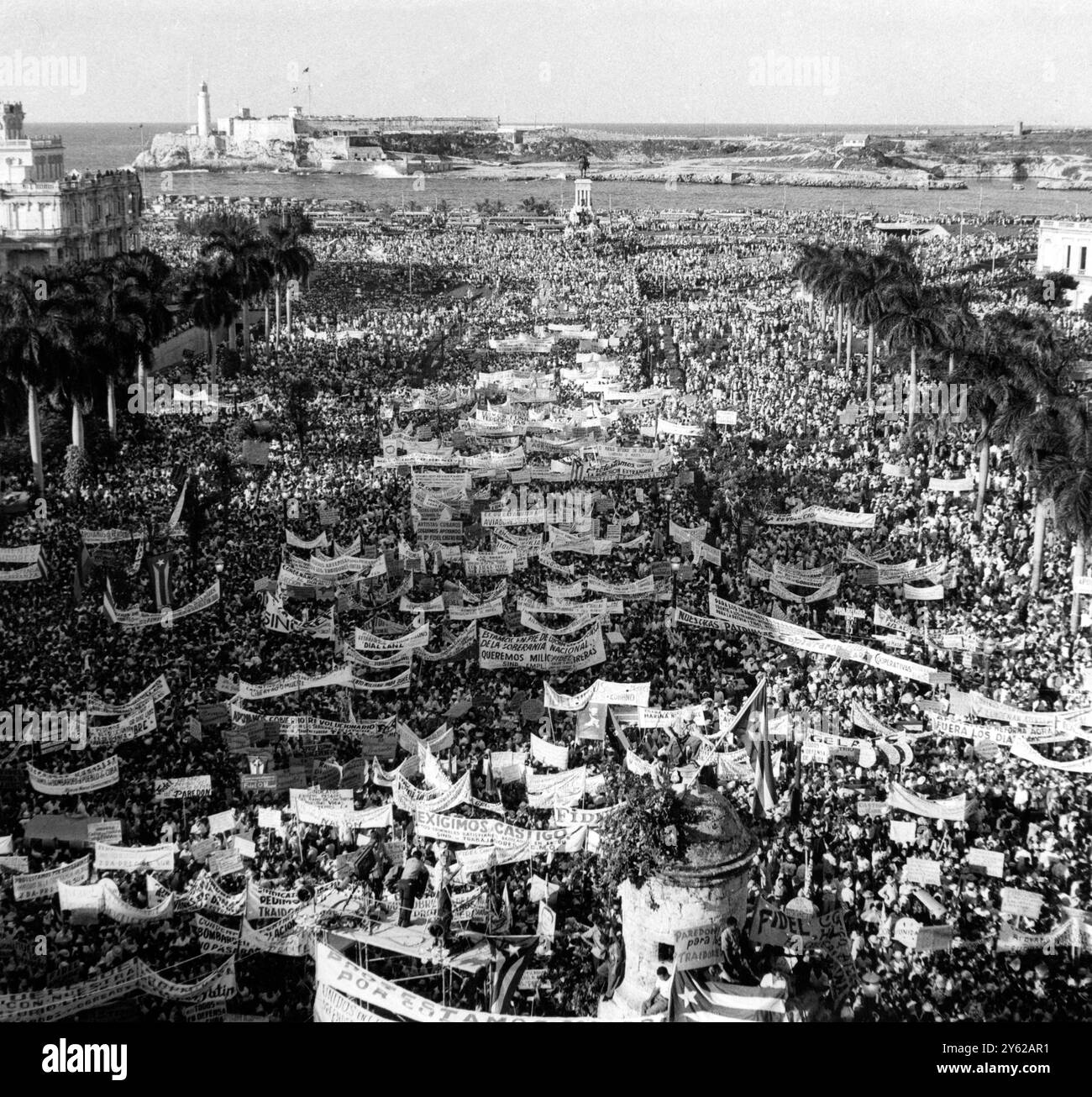 Part of the enormous , banner bearing crowd that listened to Fidel ...