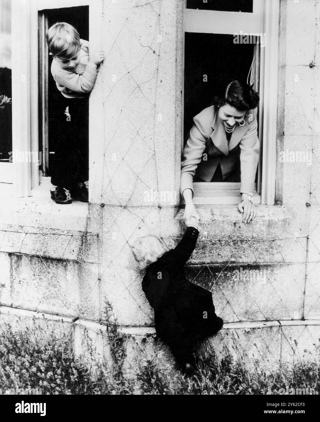 Balmoral: Prince Charles peeping round the corner as he stands on the ...