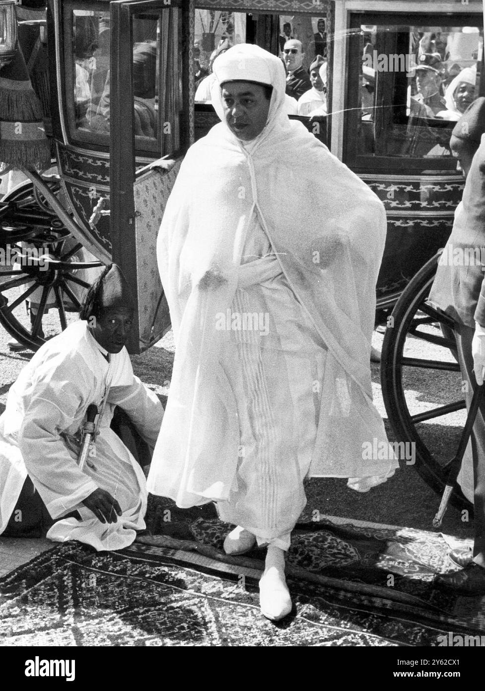 King Hassan II of Morocco clothed completely in white as he attends a ...