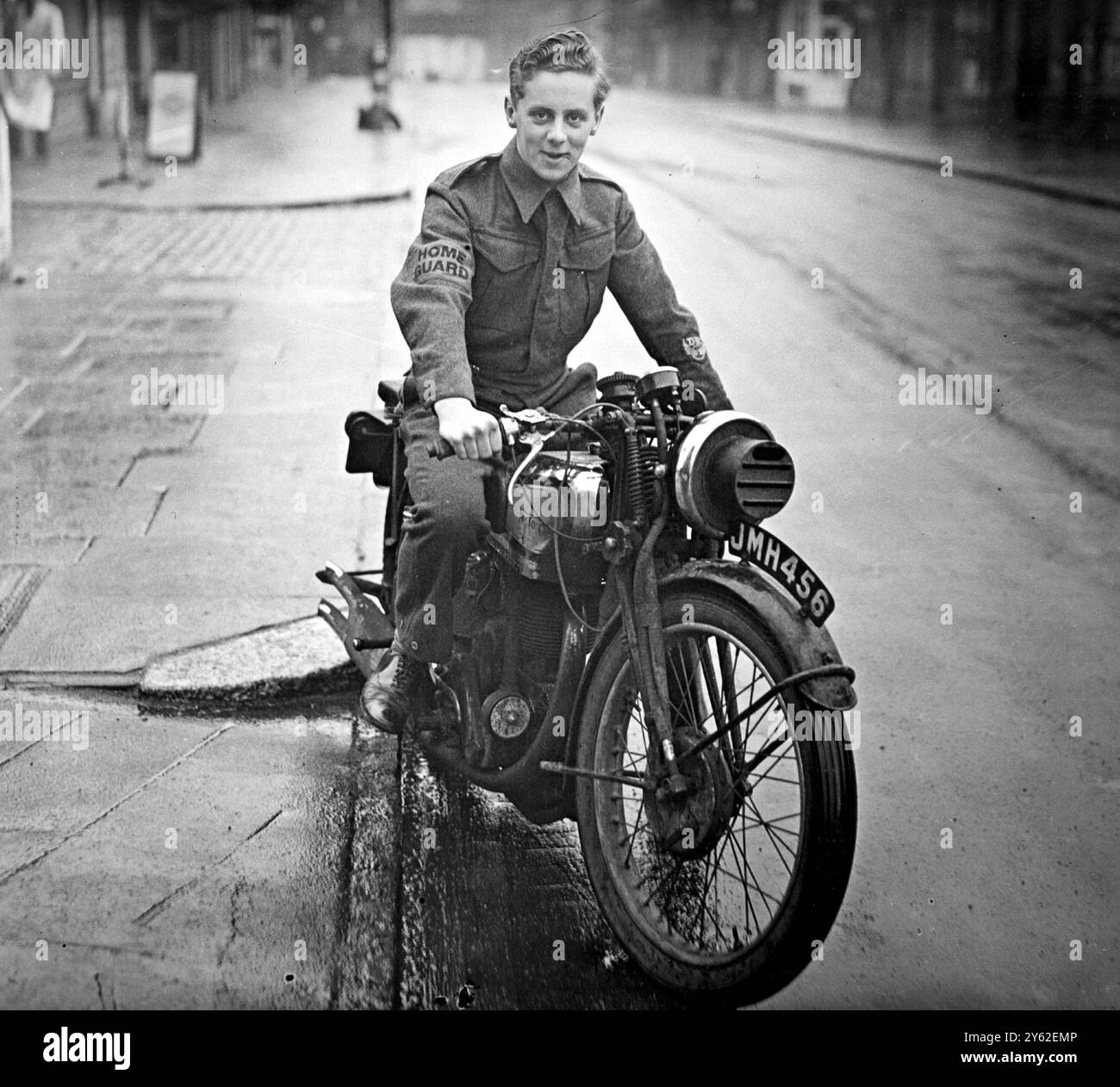 WWII A sixteen year old Home Guard Peter Derrick seated on his motor ...