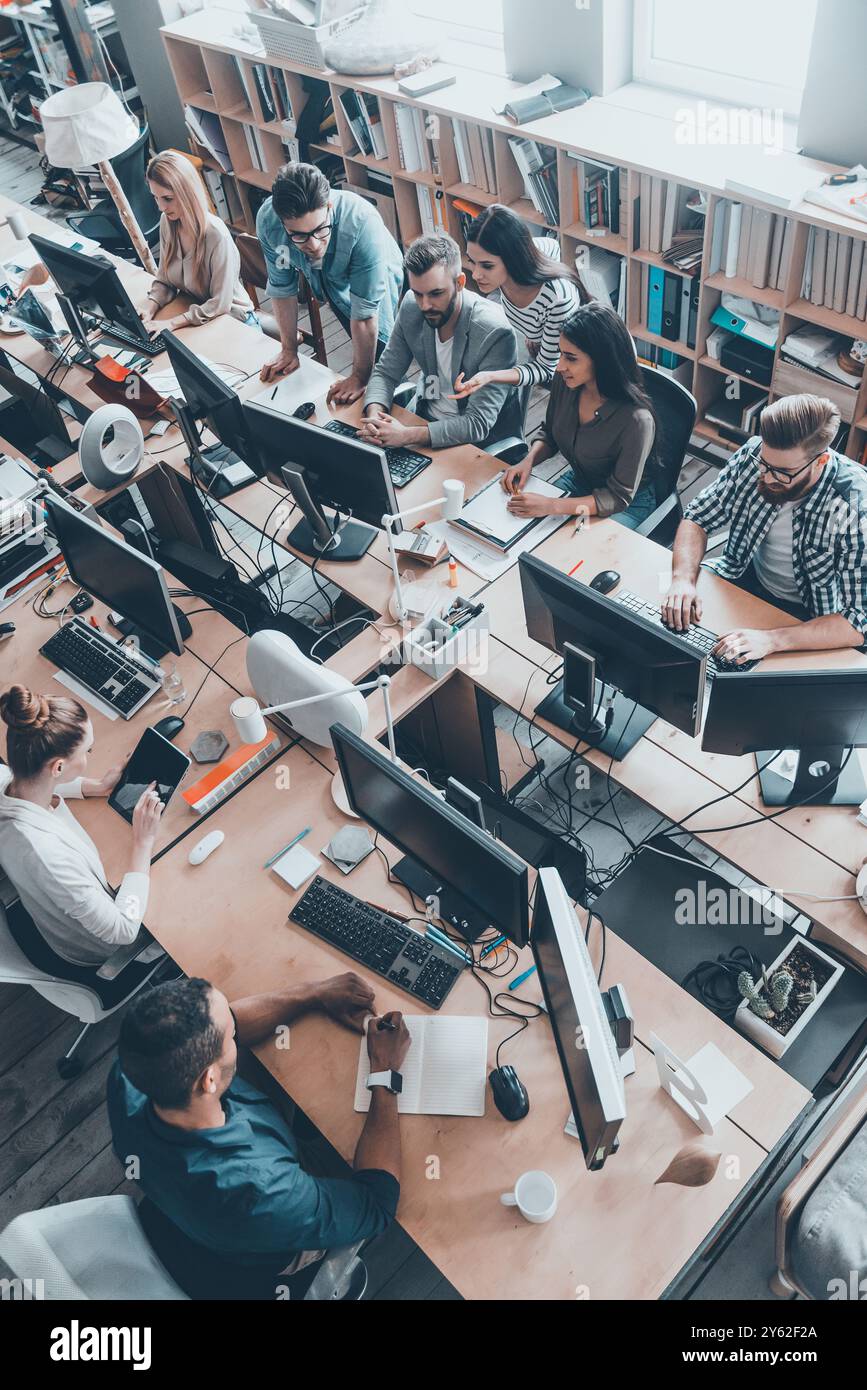 Successful team. Top view of group of young business people in smart ...