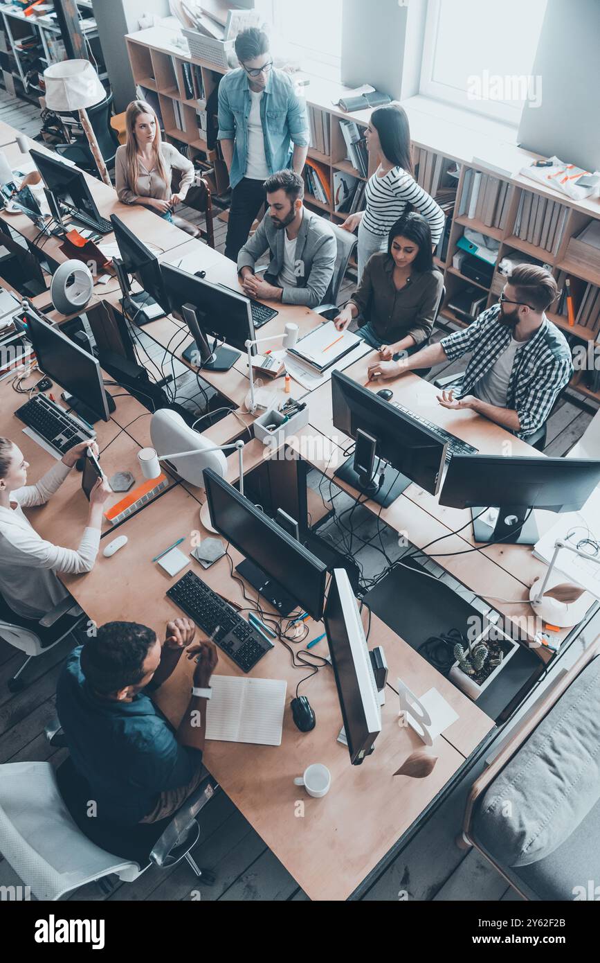 Successful young team at work. Top view of group of young business ...