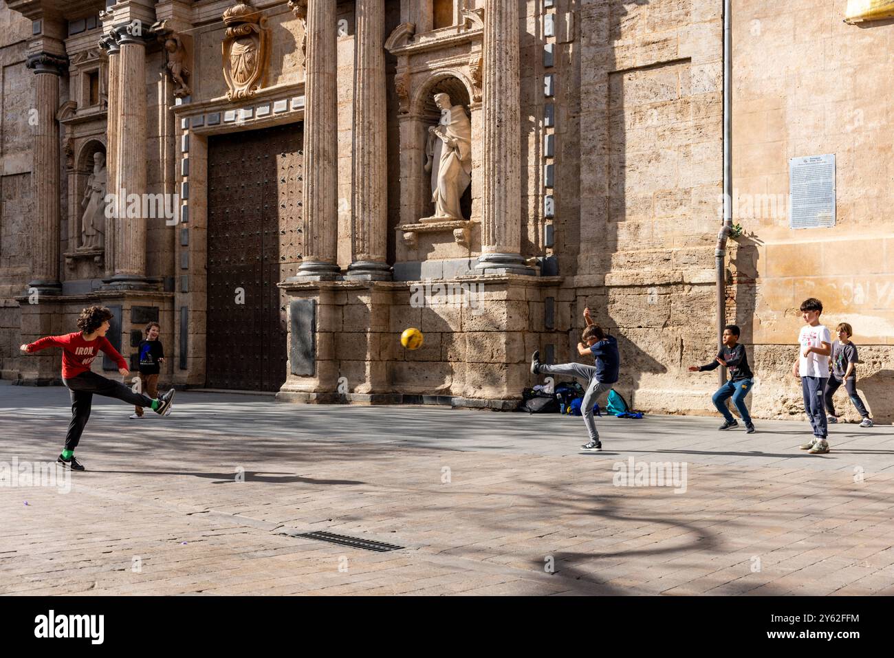 Kids play futbol in the streets of Valencia, Spain Stock Photo - Alamy