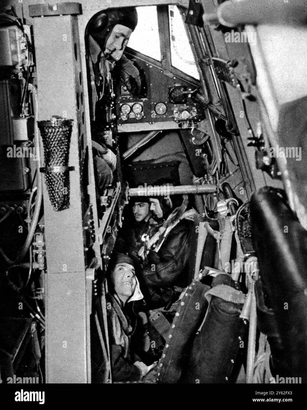 Inside a Halifax, the pilot is above, and below him are the bomb aimer ...