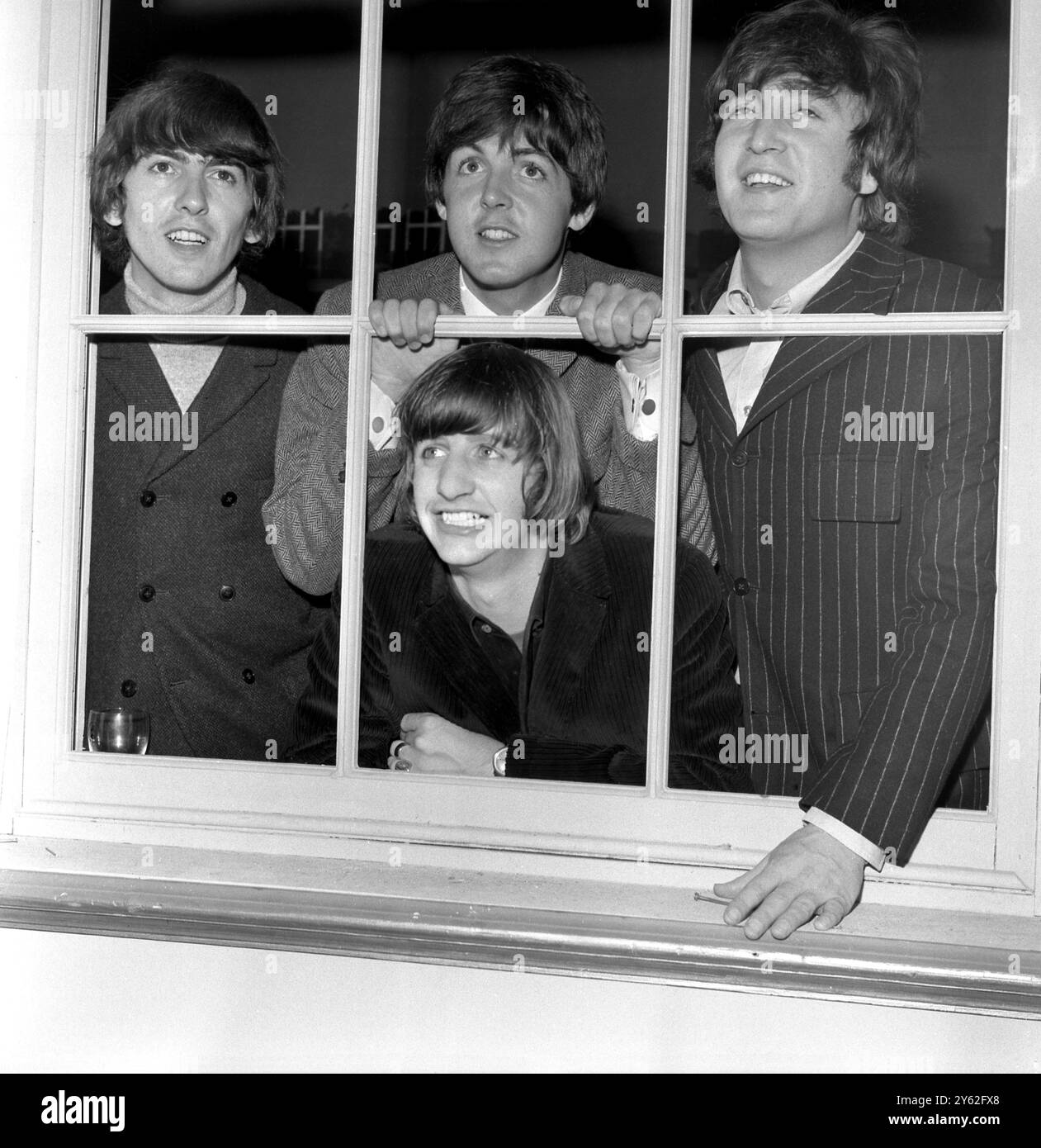 The Beatles . Left to right - George Harrison , Paul McCartney and John ...