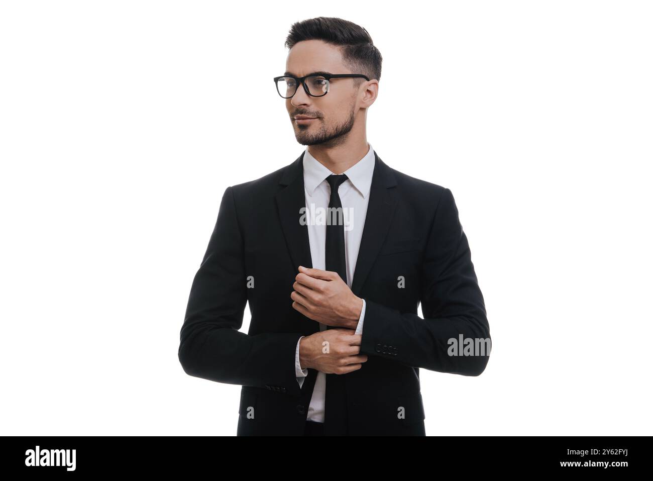 Used to look perfect. Handsome young man in full suit adjusting his ...