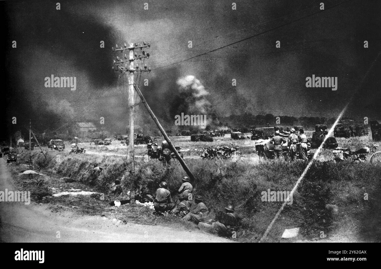 A dramatic war picture, showing fires caused by bombing with a solid ...
