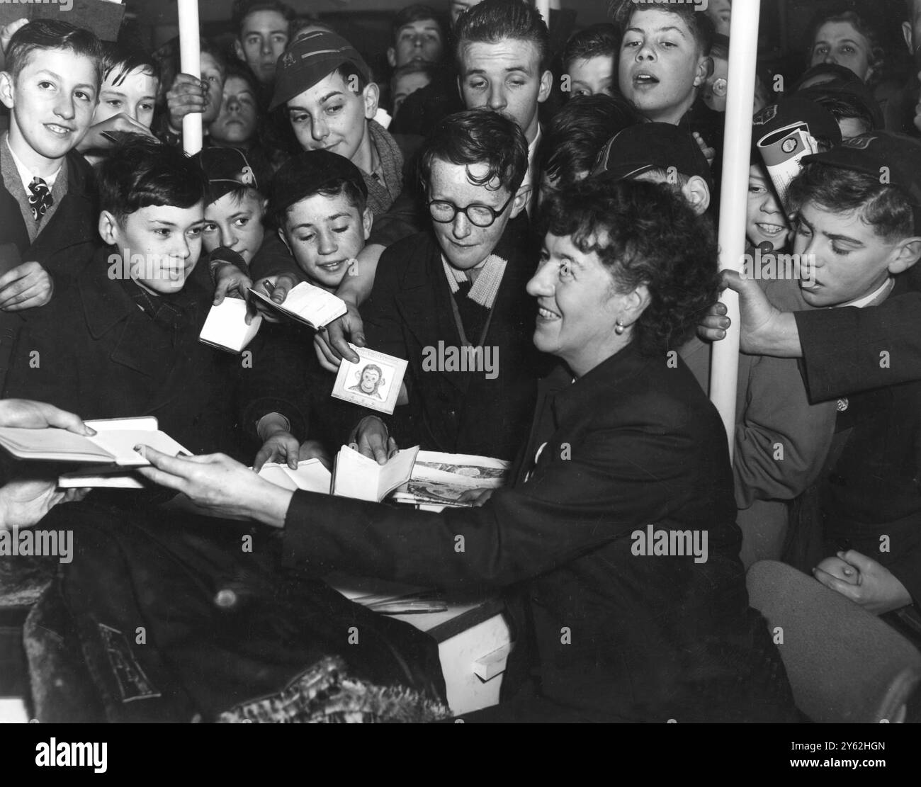 Enid Blyton Children's author Signing autographs to eager schoolboys in ...