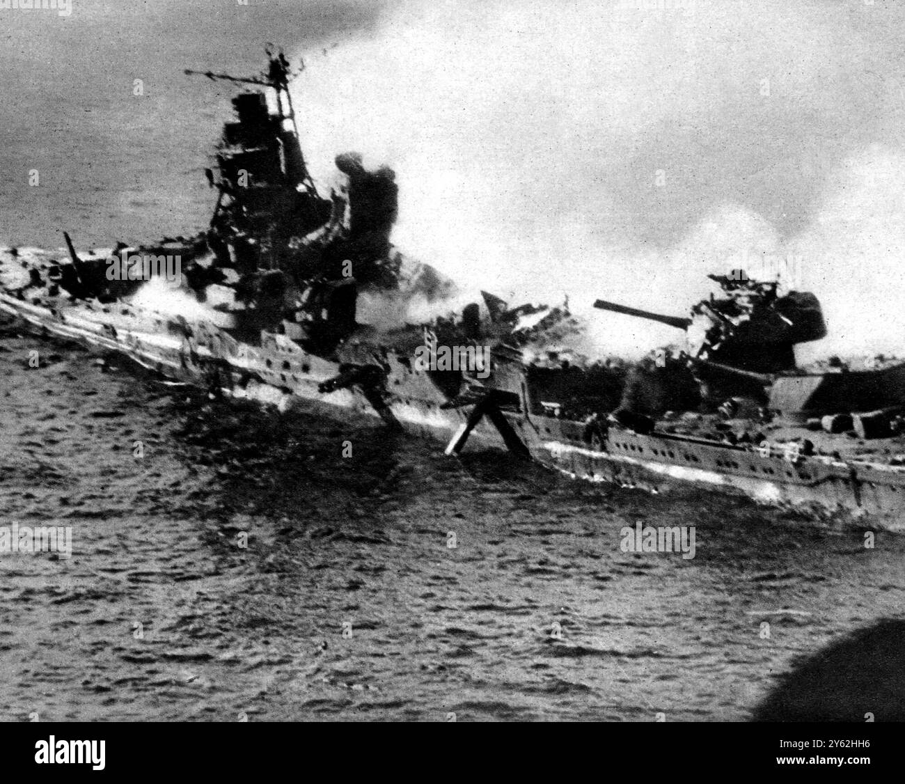 An overhead view of the Japanese cruiser 'Mogami', billowing smoke ...