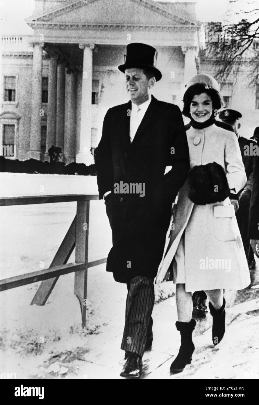 President John Kennedy and Mrs Jacqueline Kennedy walk along a platfrom ...
