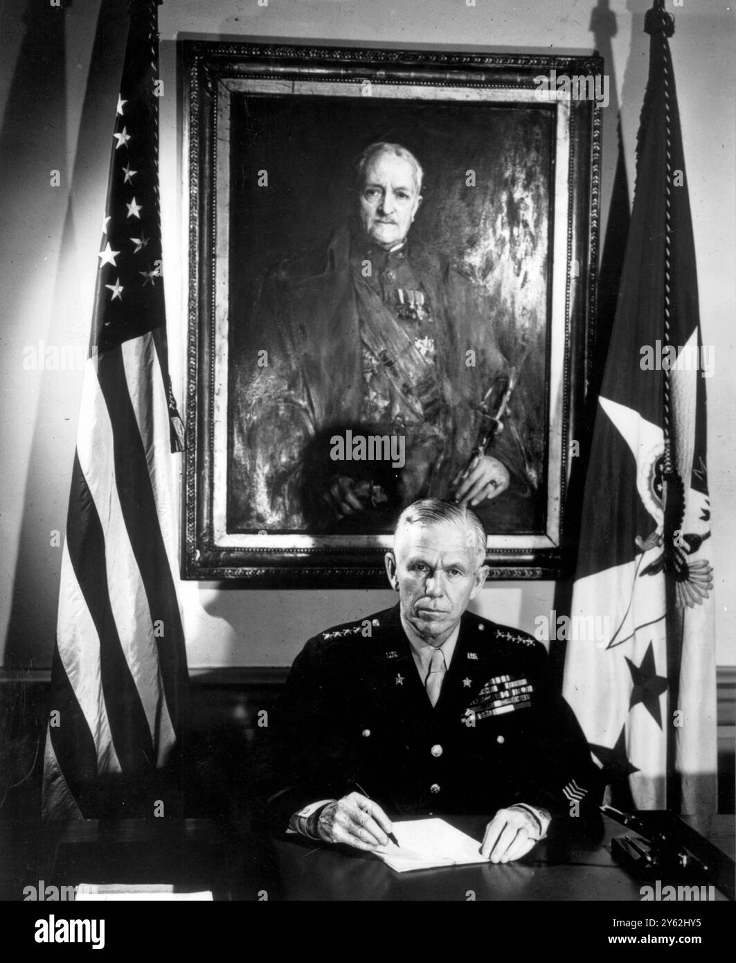 General George C Marshall infront of a portrait of General Pershing ...