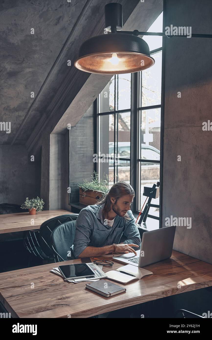 Feeling passionate about his project. Top view of thoughtful young man ...