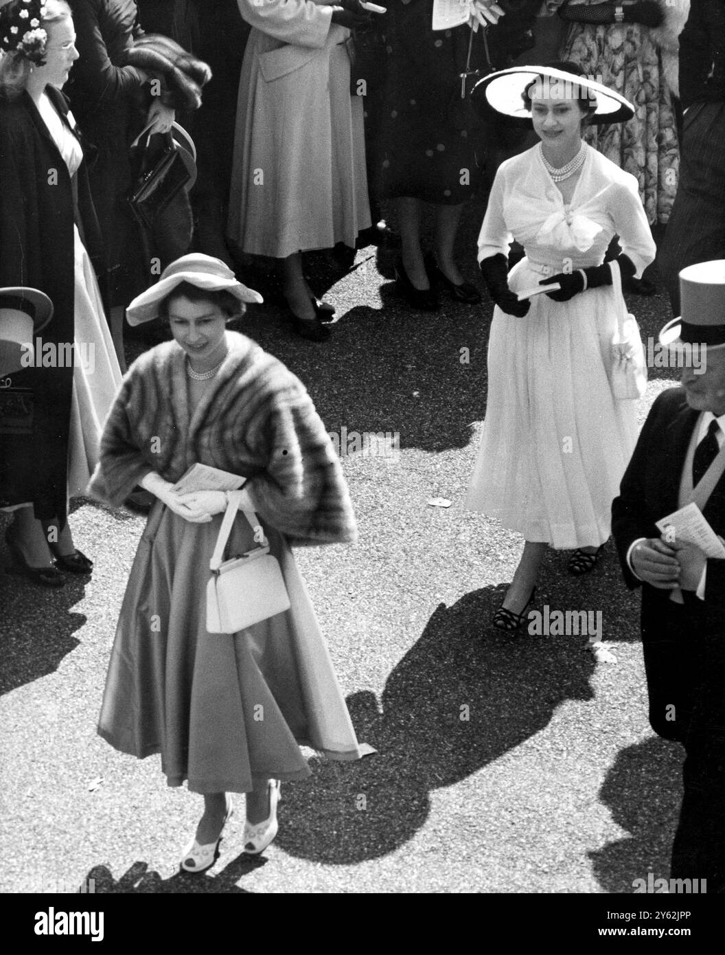 The Queen and Princess Margaret make their way through the paddock at ...