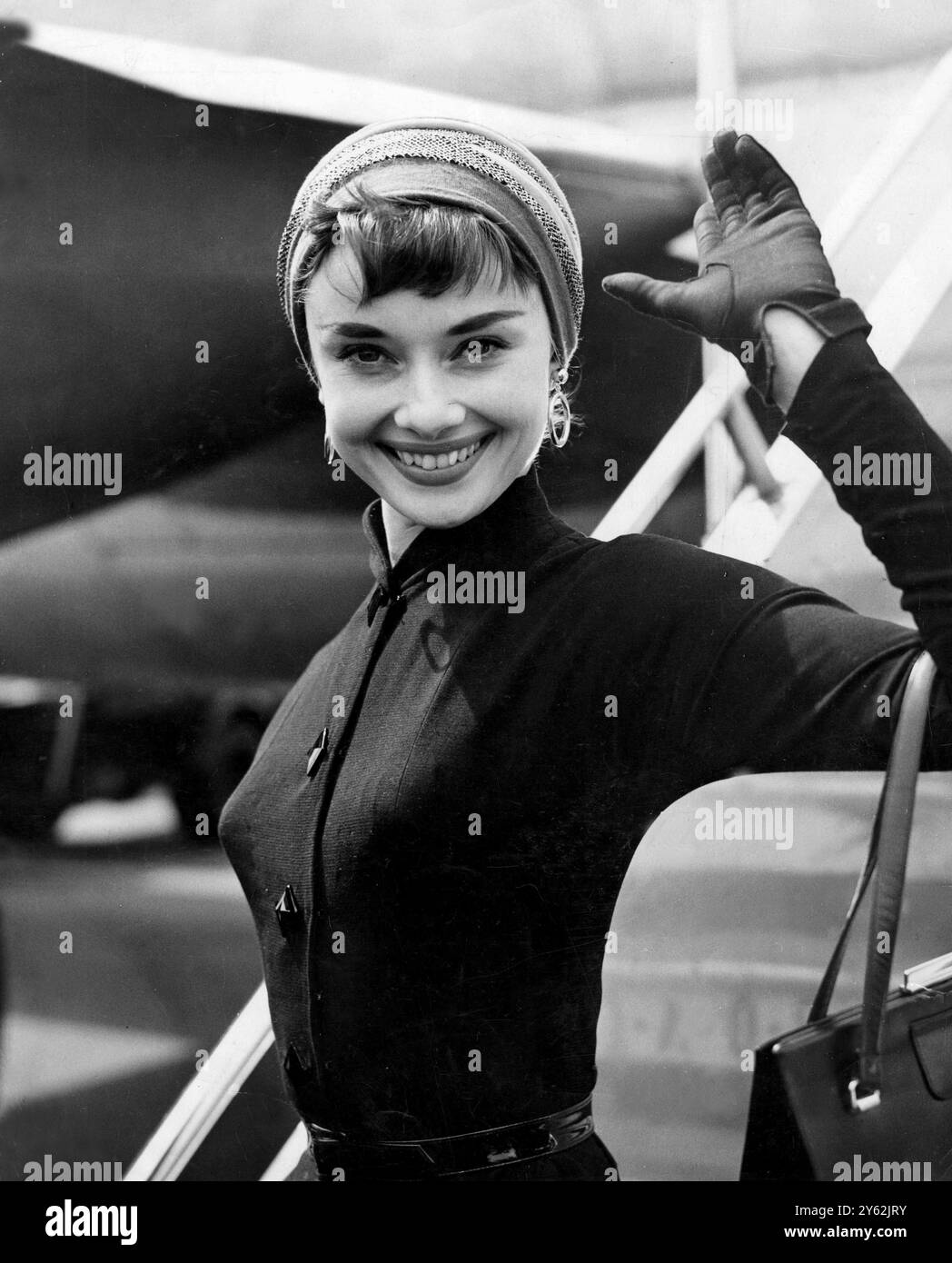 Film actress Audrey Hepburn in turban style hat arrives at London ...