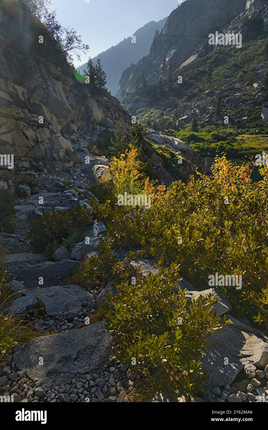 Hiking trail along a small pond at the mountain side Stock Photo - Alamy