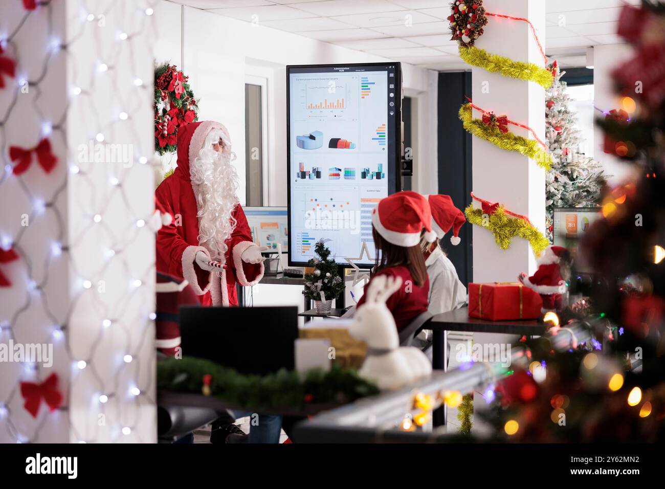 Motivational speaker dressed as Santa Claus teaching employees ...