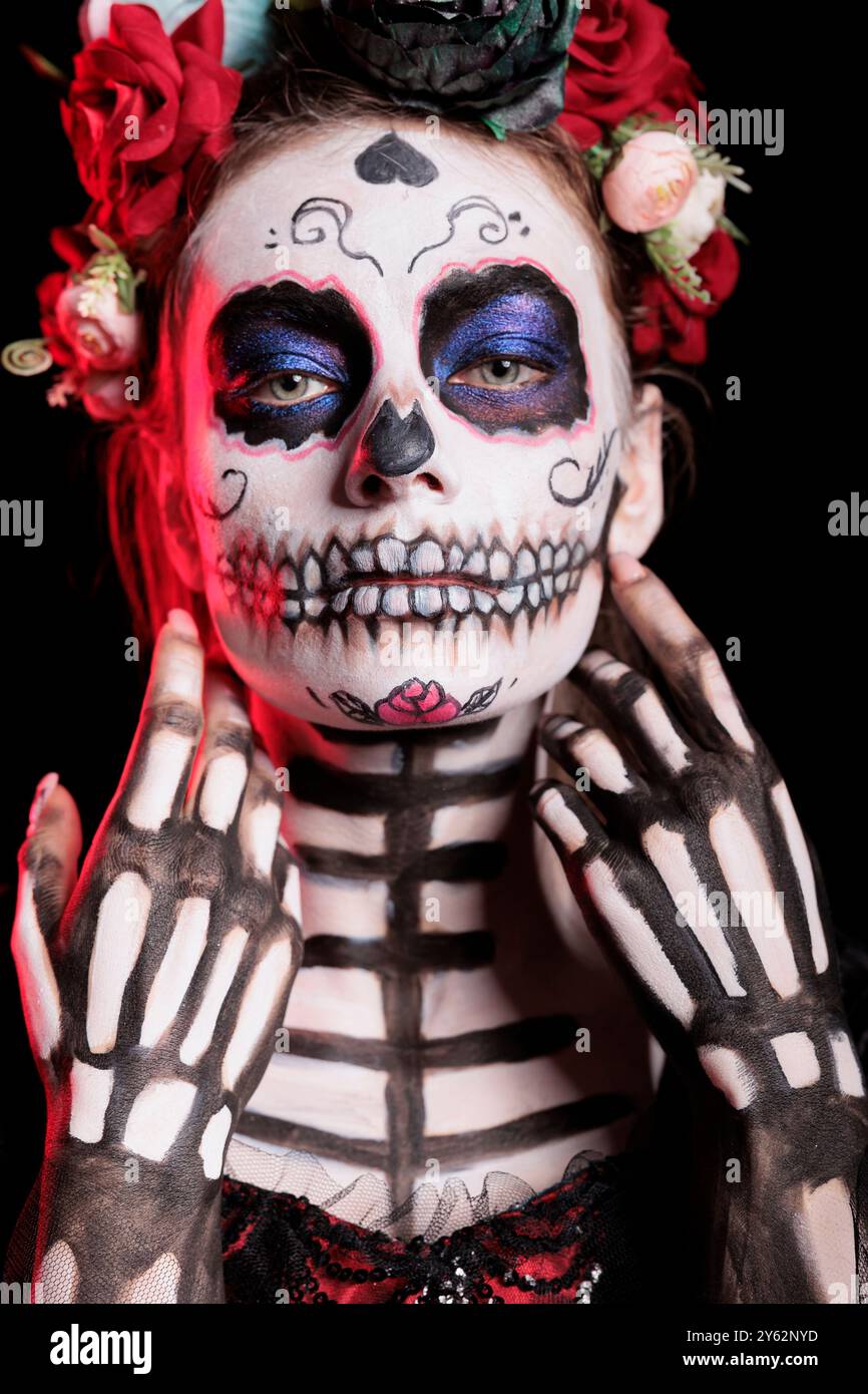 Headshot portrait of girl wearing corpse makeup to celebrate dios de ...